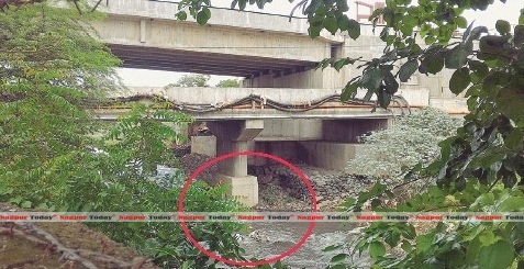 A concrete pillar amidst Pili Nadi near Mankapur obstructing flow of ...